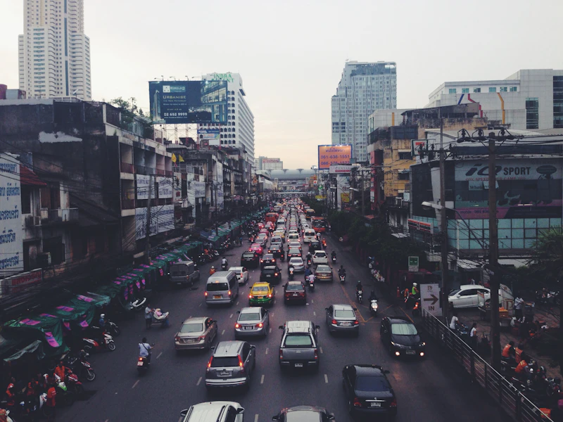 Downtown street from above | assorted cars on asphalt road beside buildings